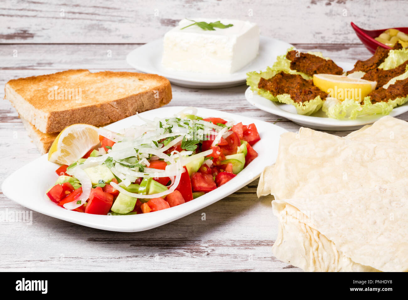 Lavas, traditional Turkish flat bread and salad on white wooden ...