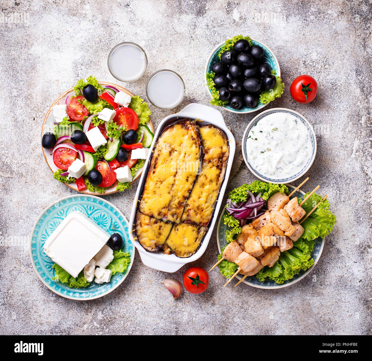 Assortment of traditional greek dishes. Salad, tzatziki, feta, meze ...