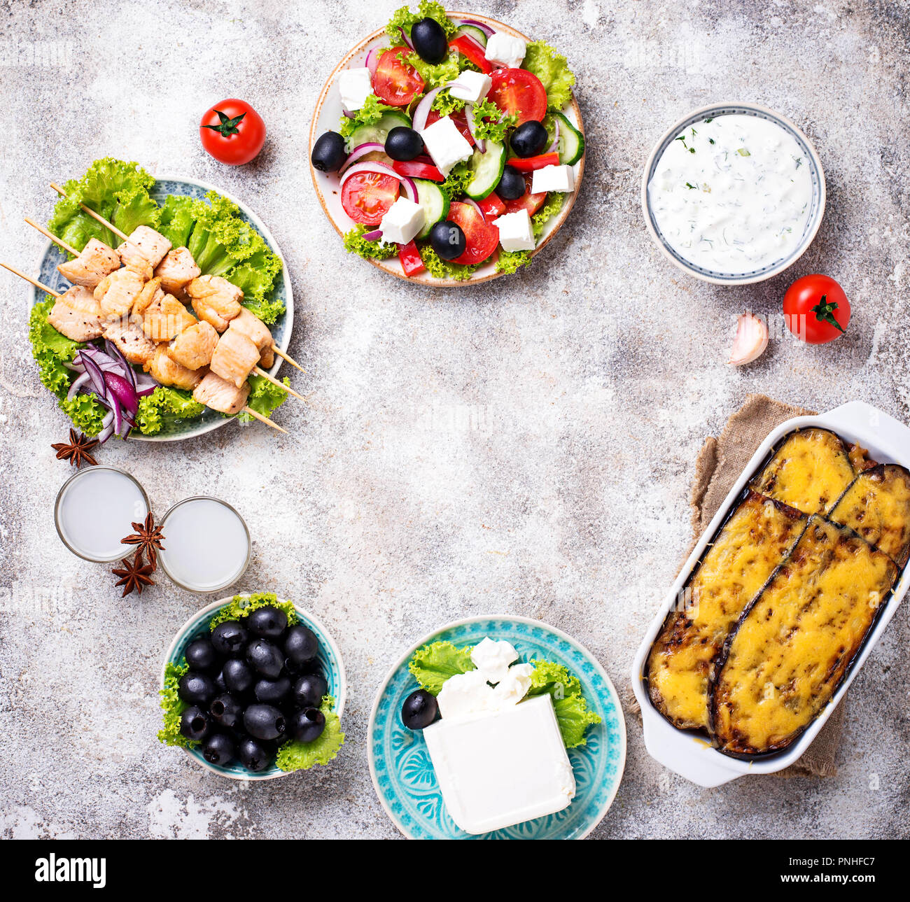 Assortment of traditional greek dishes. Salad, tzatziki, feta, meze ...
