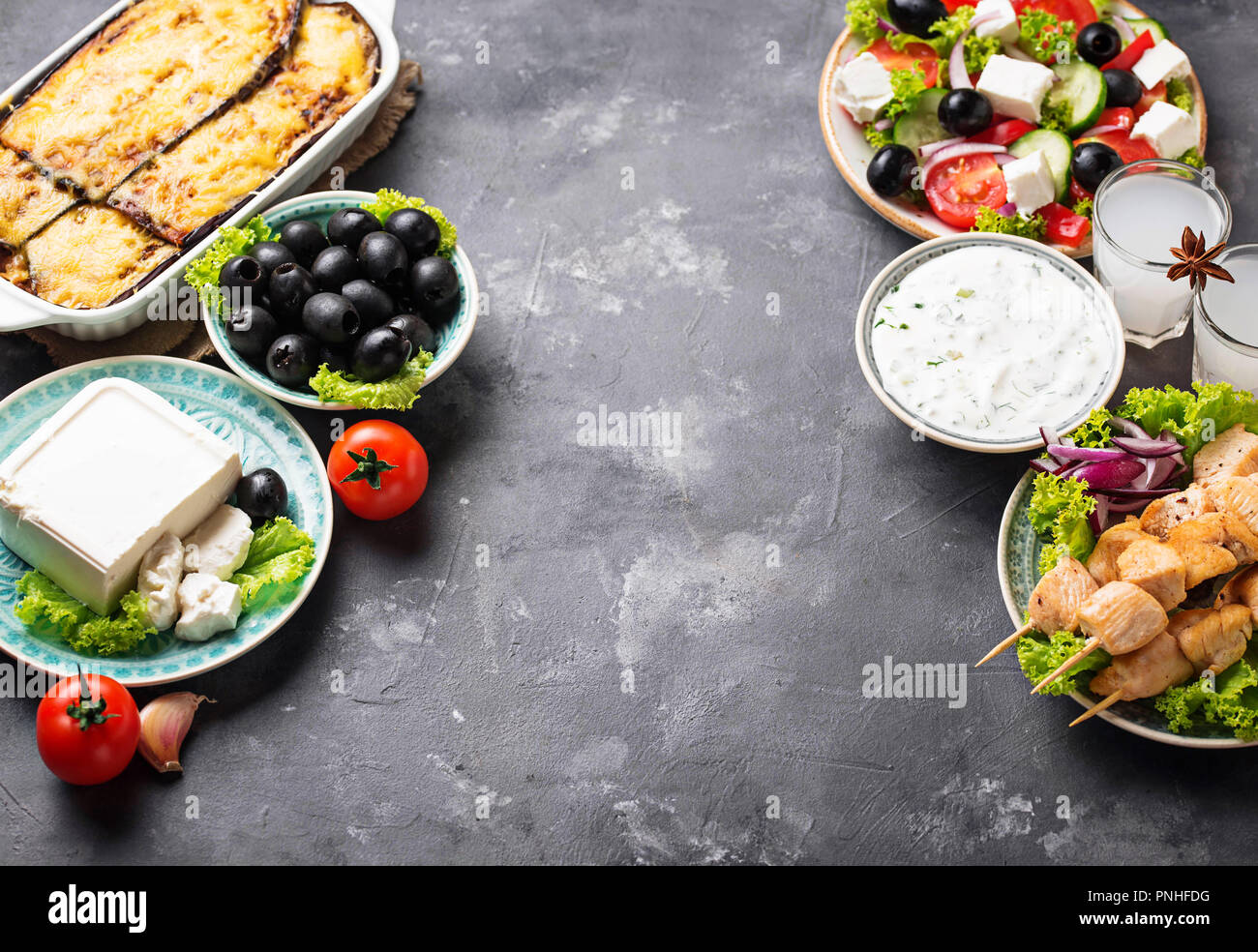 Assortment of traditional greek dishes. Salad, tzatziki, feta, meze ...