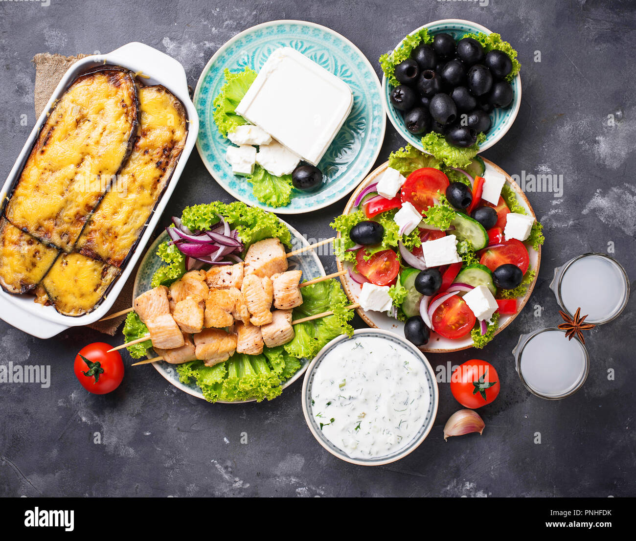 Assortment of traditional greek dishes. Salad, tzatziki, feta, meze ...