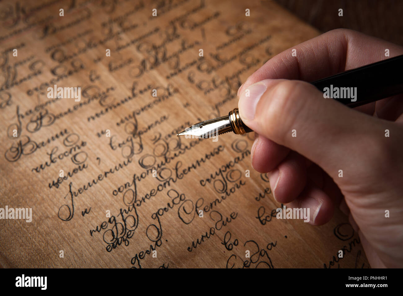 fountain pen in the hand on letter with text close up Stock Photo - Alamy