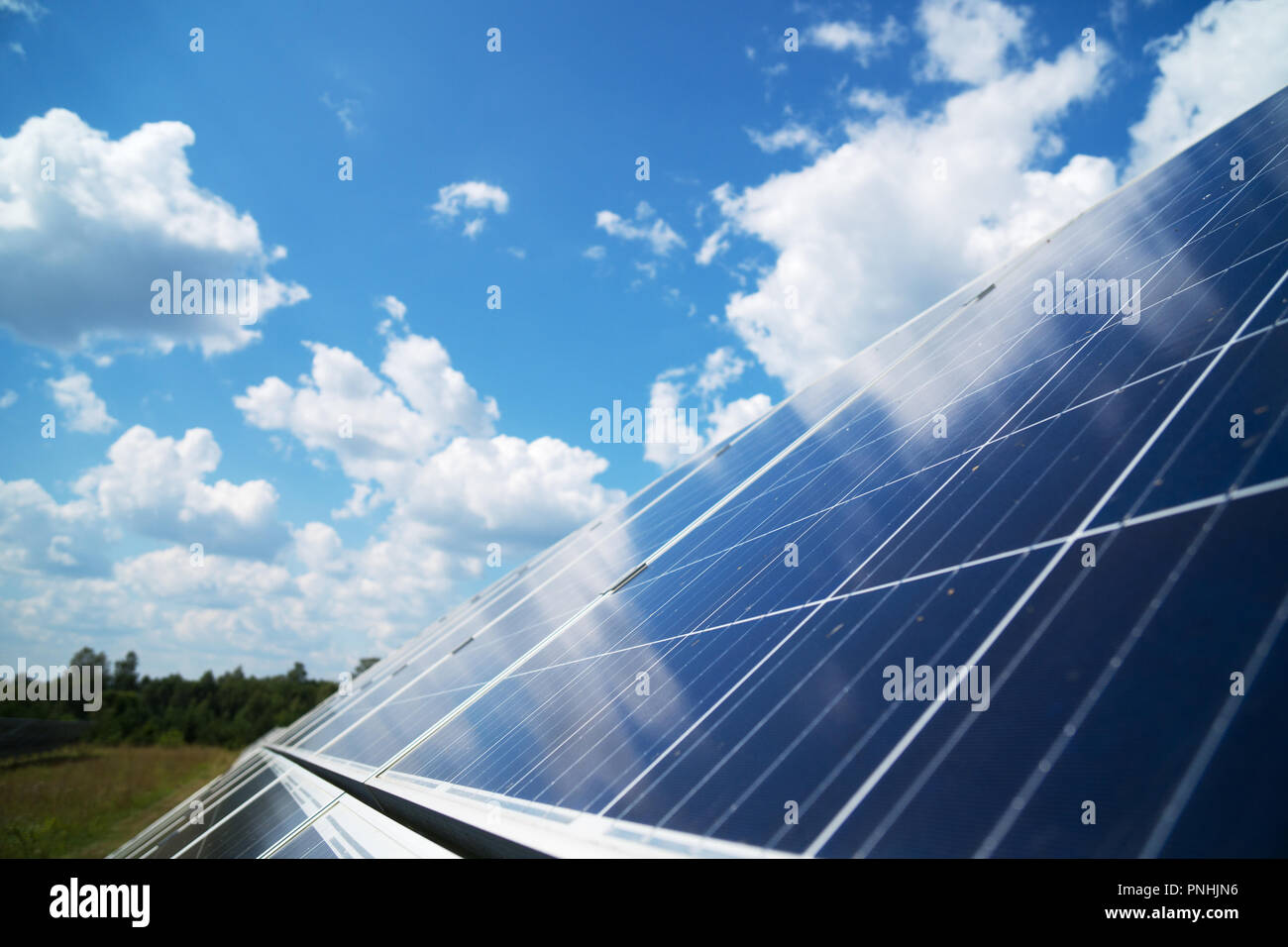 Blue solar panels over blue sky. Renewable energy Stock Photo - Alamy
