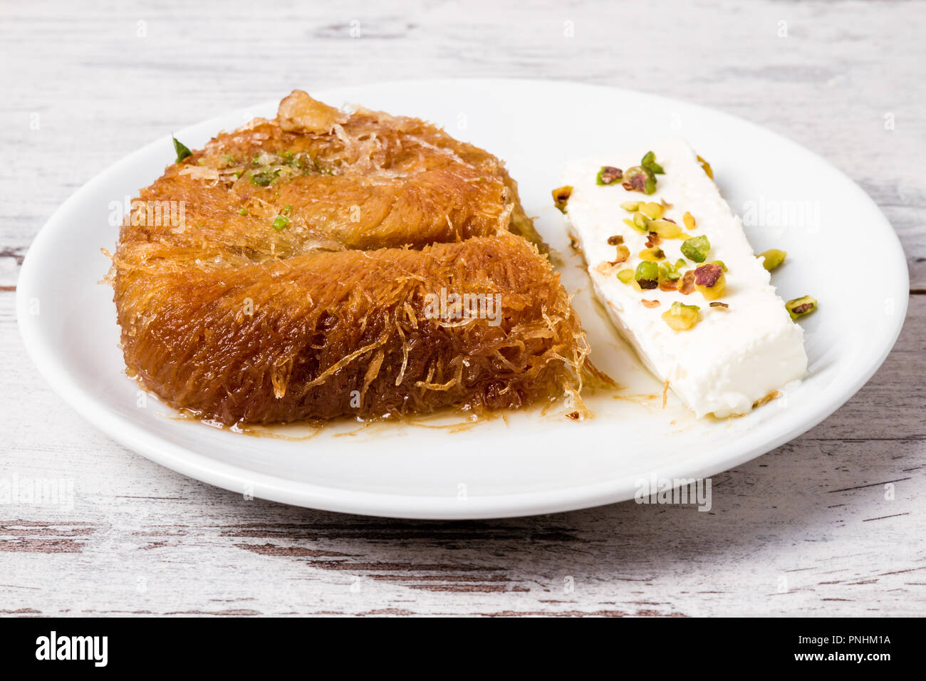 Turkish style sweet creamy pastry, kadayif on white background Stock ...
