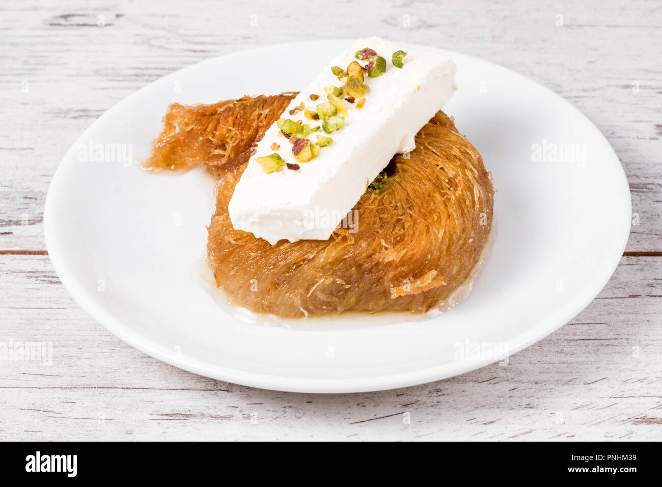 Turkish style sweet creamy pastry, kadayif on white background Stock ...