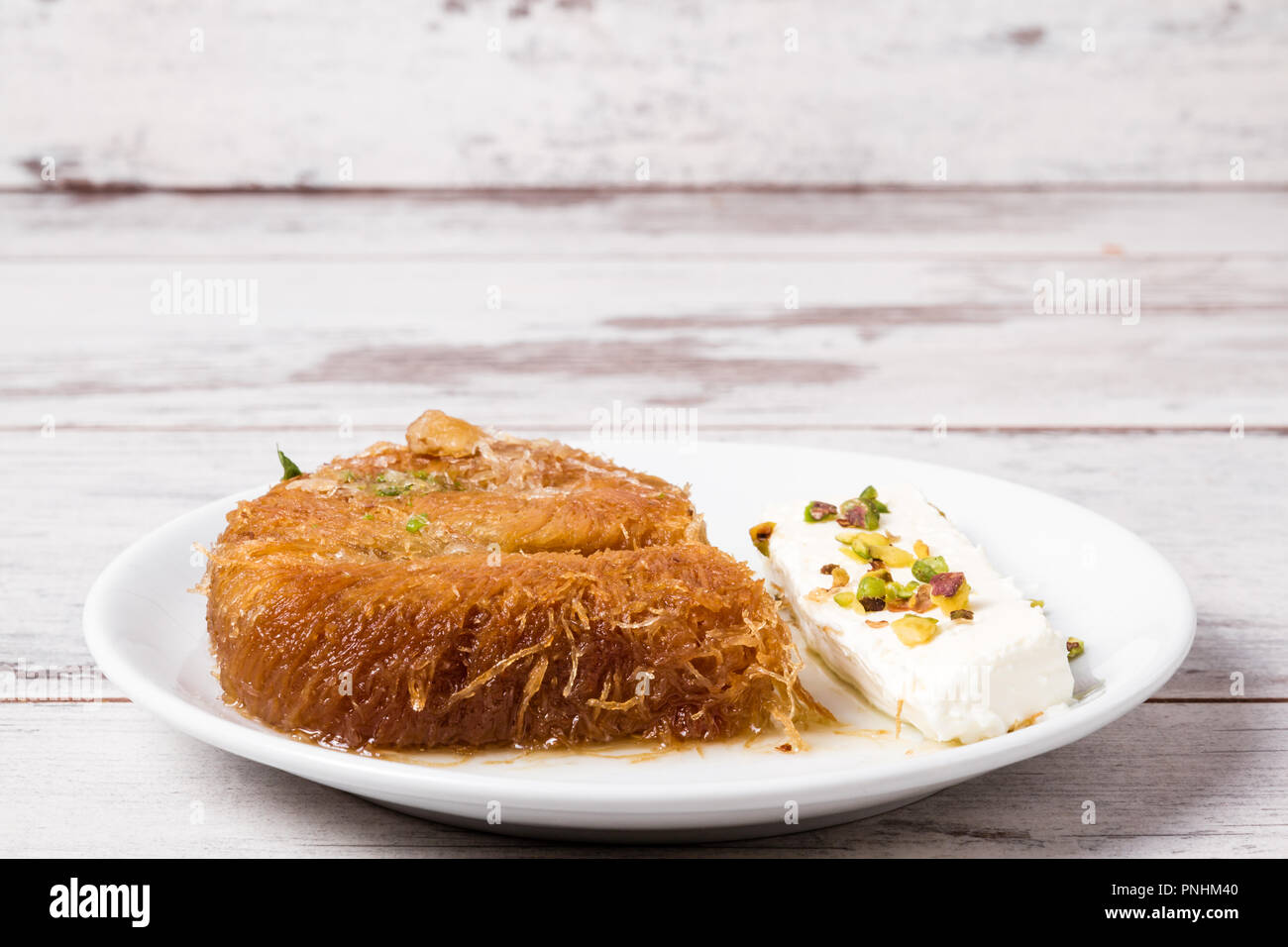 Turkish style sweet creamy pastry, kadayif on white background Stock ...