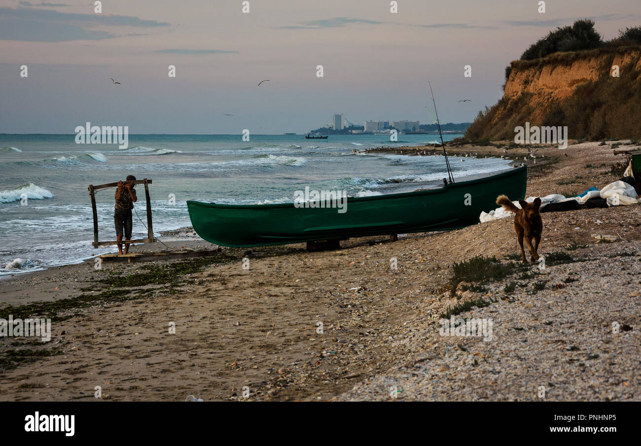 TUZLA, ROMANIA - SEPTEMBER 15, 2018. Fisherman at the sunrise on the ...
