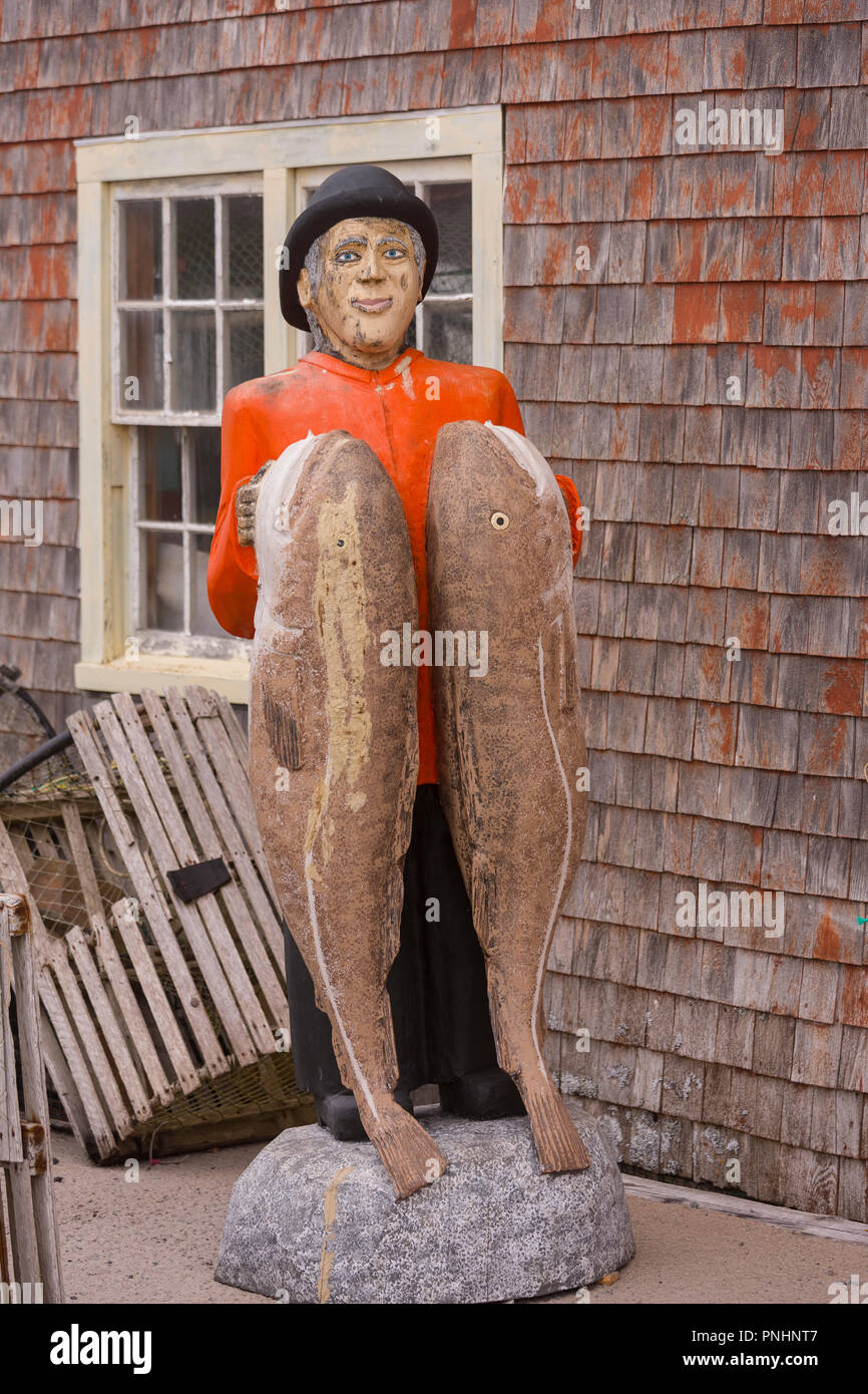 PEGGY'S COVE, NOVA SCOTIA, CANADA - Wooden statue of fisherman and cod ...