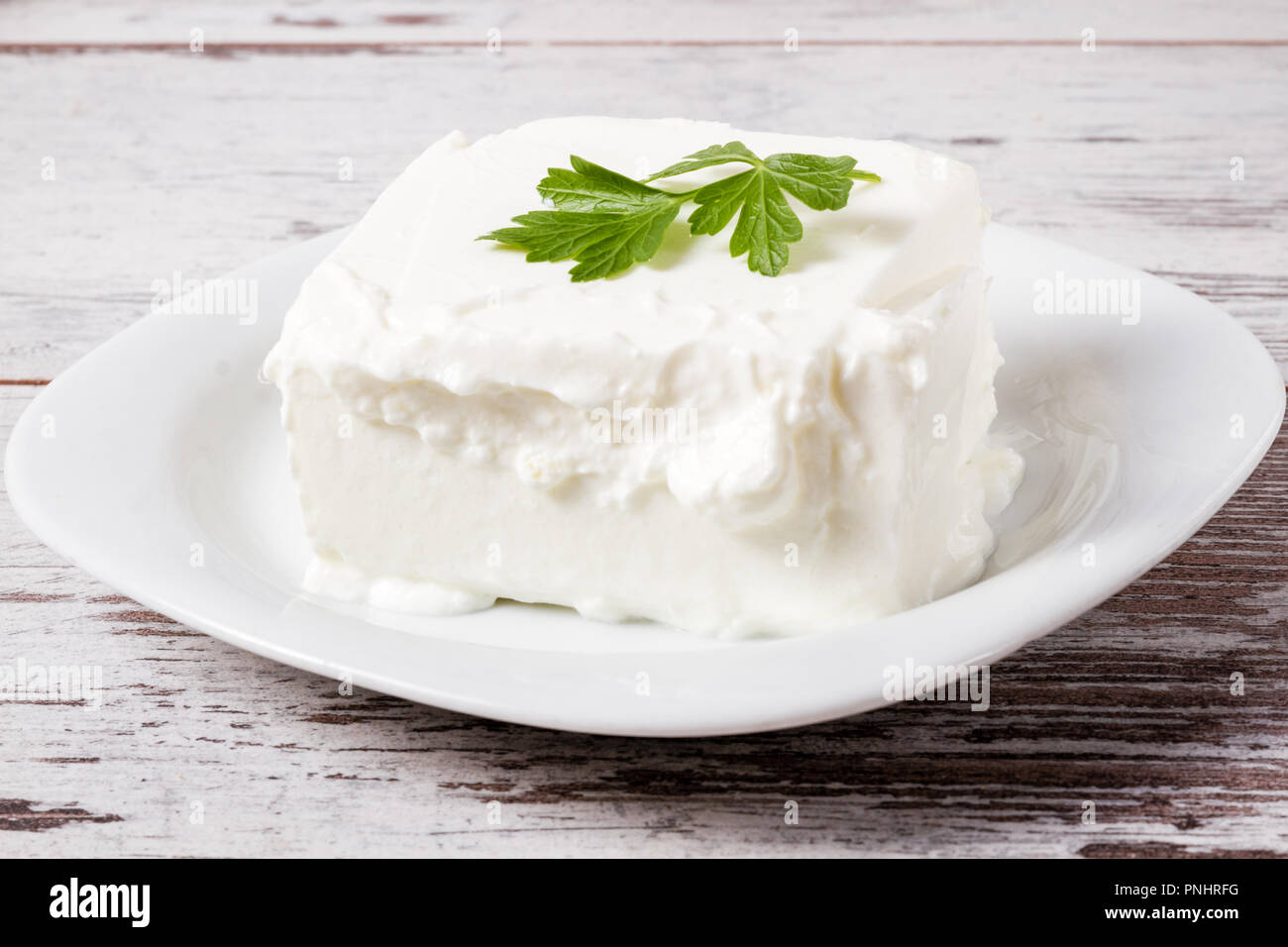 Traditional plain yoghurt made from buffalo milk on white background ...