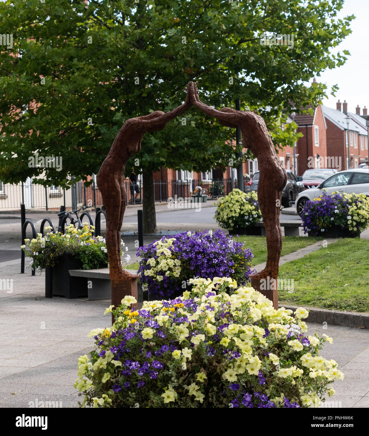 Communal street art figures in a suburb Stock Photo - Alamy