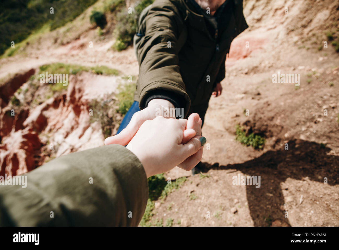 Helping hand mountain climbing hi-res stock photography and images - Alamy