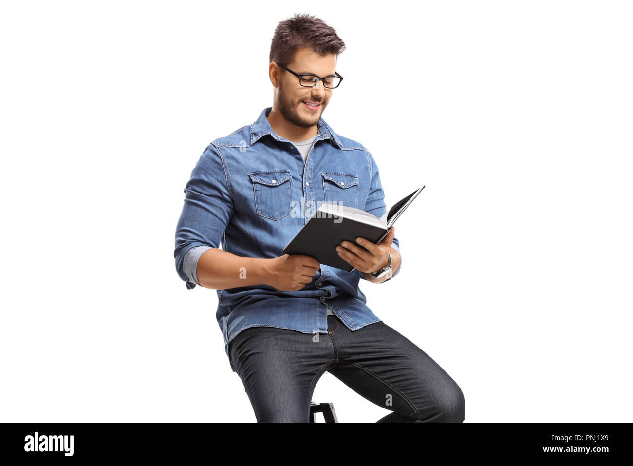 Young guy reading a book isolated on white background Stock Photo - Alamy