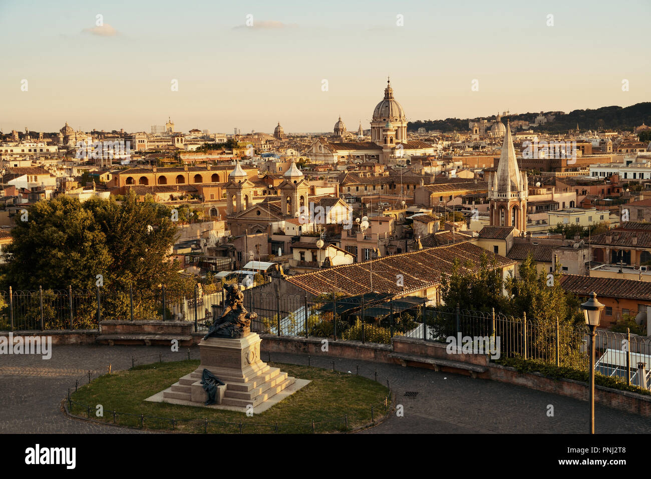 Rome viewed from park with ancient architecture at sunset in Italy ...
