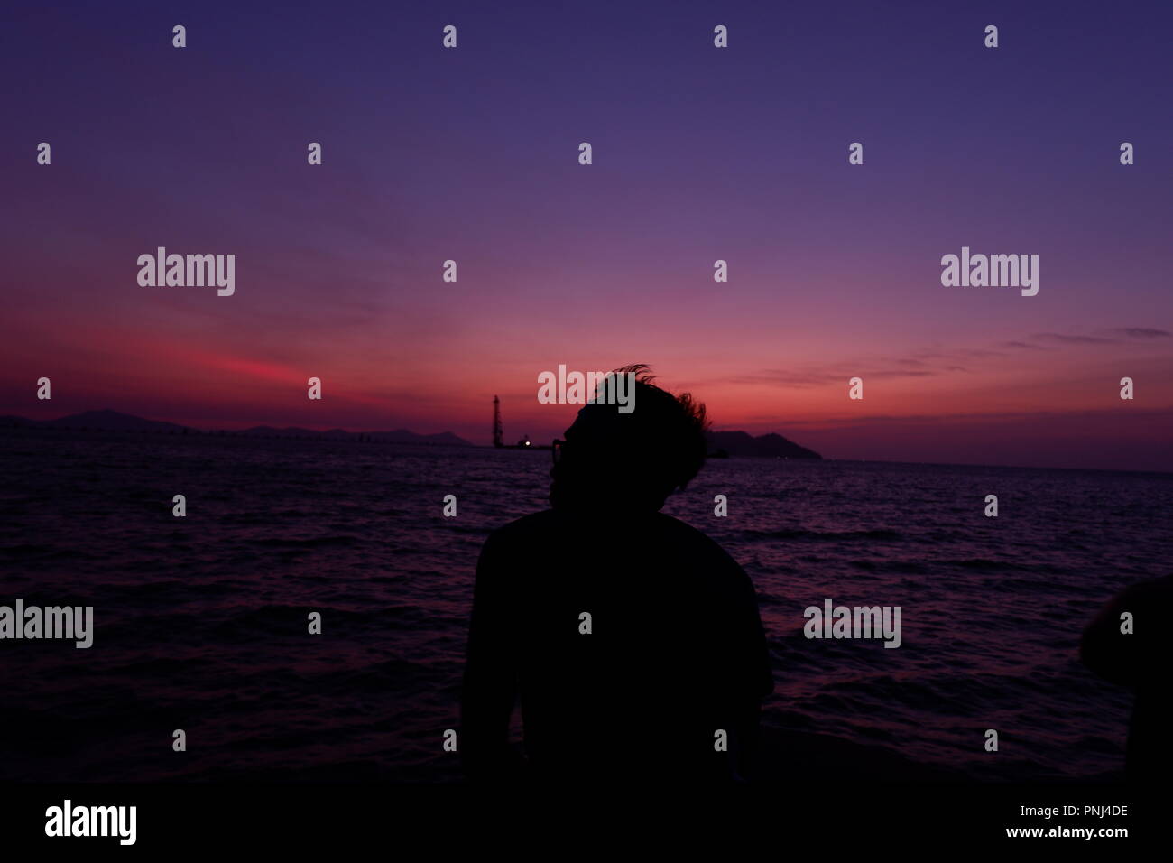 Man watching sunset hi-res stock photography and images - Alamy