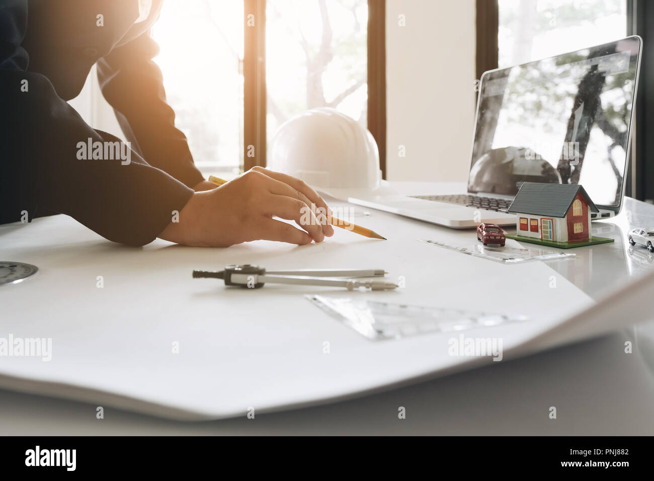 Engineer or Architect concept, Image of engineer drawing a blue print ...