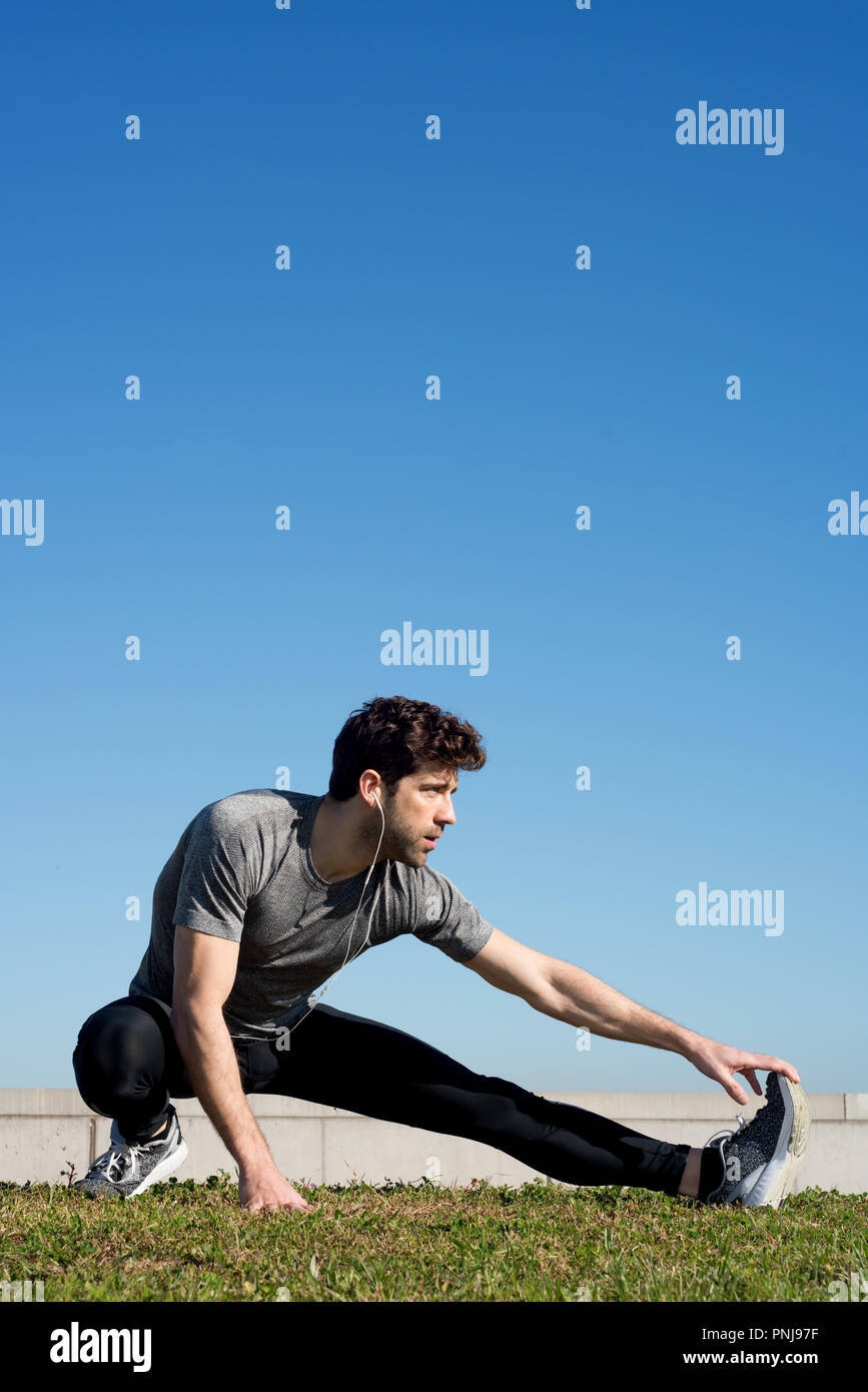 Person stretching grass hi-res stock photography and images - Alamy