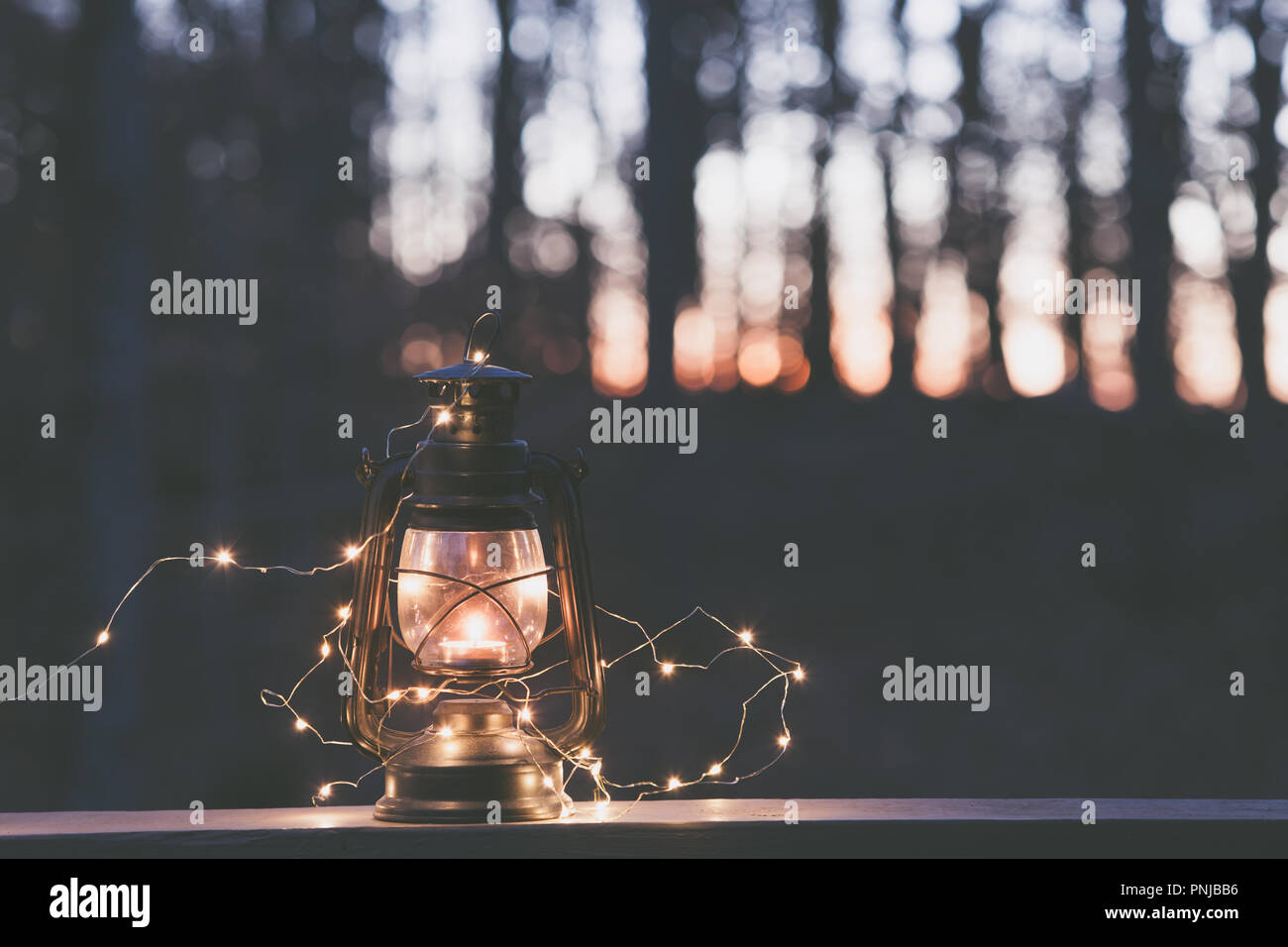 Old fashioned lantern in darkness. Vintage style metal lamp outdoor ...