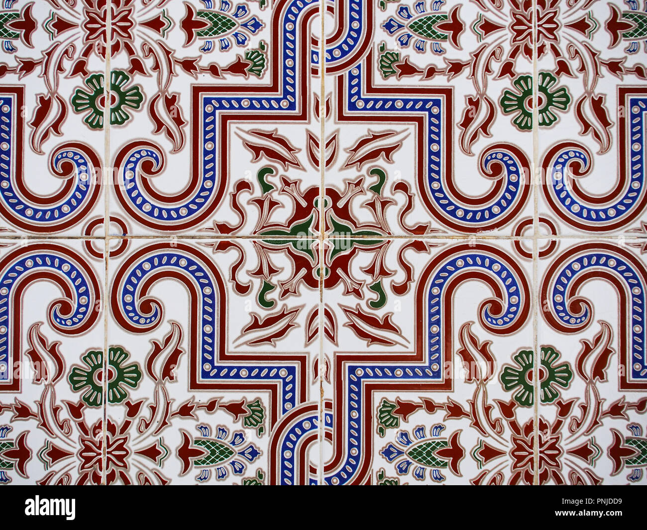 Detail of the traditional tiles from facade of old house. Decorative ...