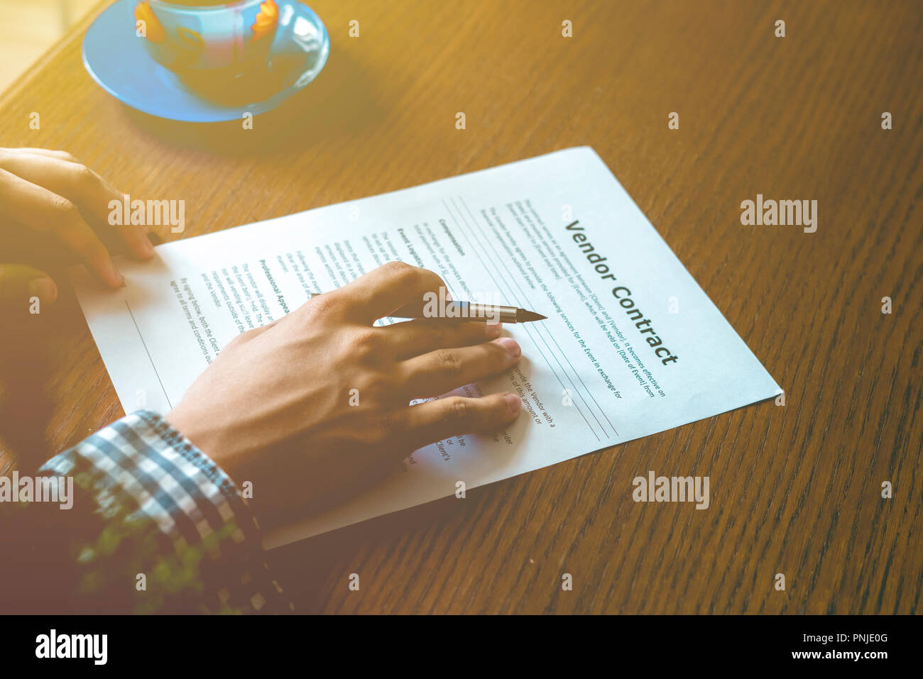 close up hand sign vendor contract on the table for the new house ...