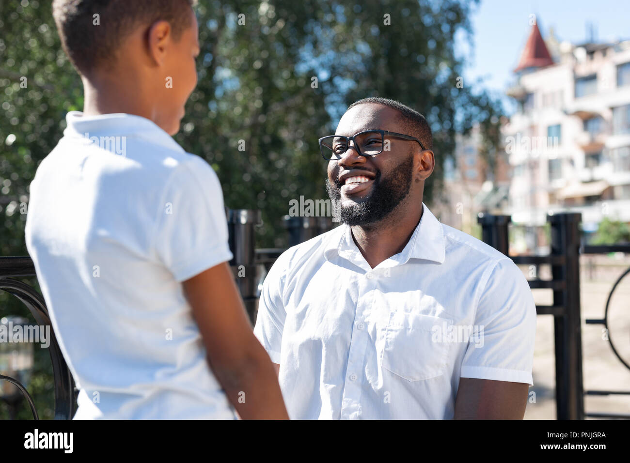 Cheerful positive afro American man feeling happy Stock Photo - Alamy