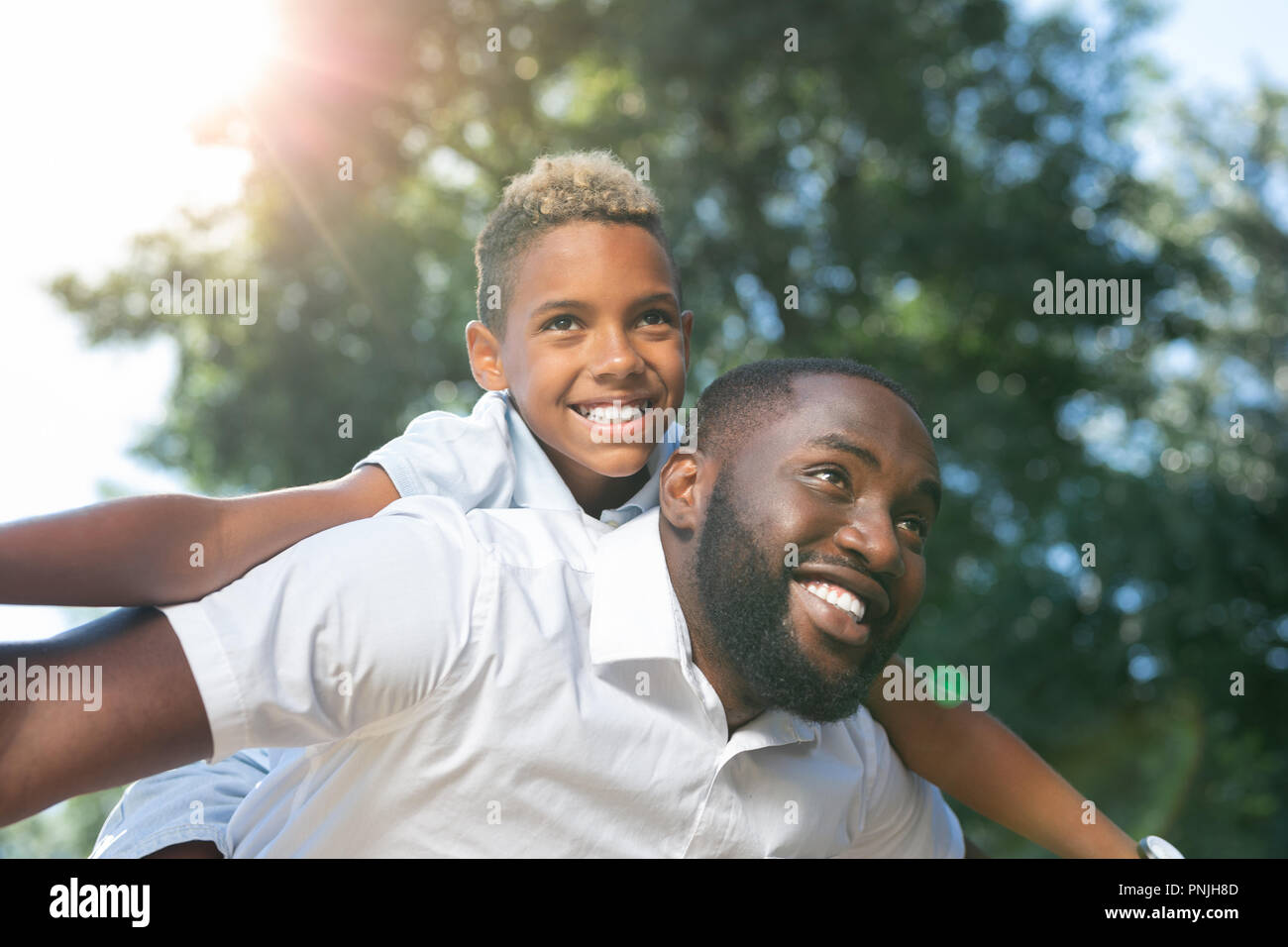 Nice happy joyful boy expressing his happiness Stock Photo - Alamy