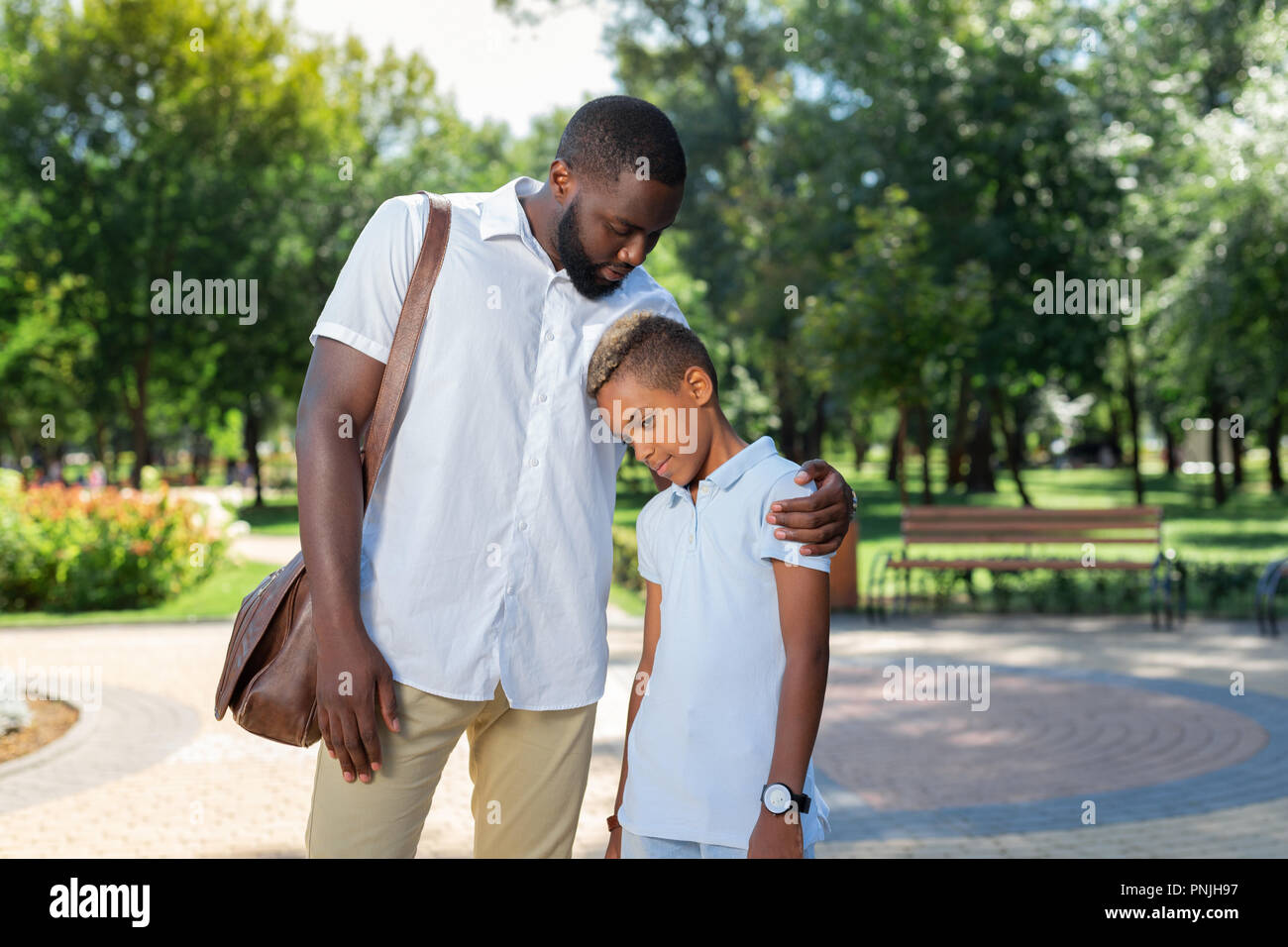 Kid touching shoulder hi-res stock photography and images - Alamy
