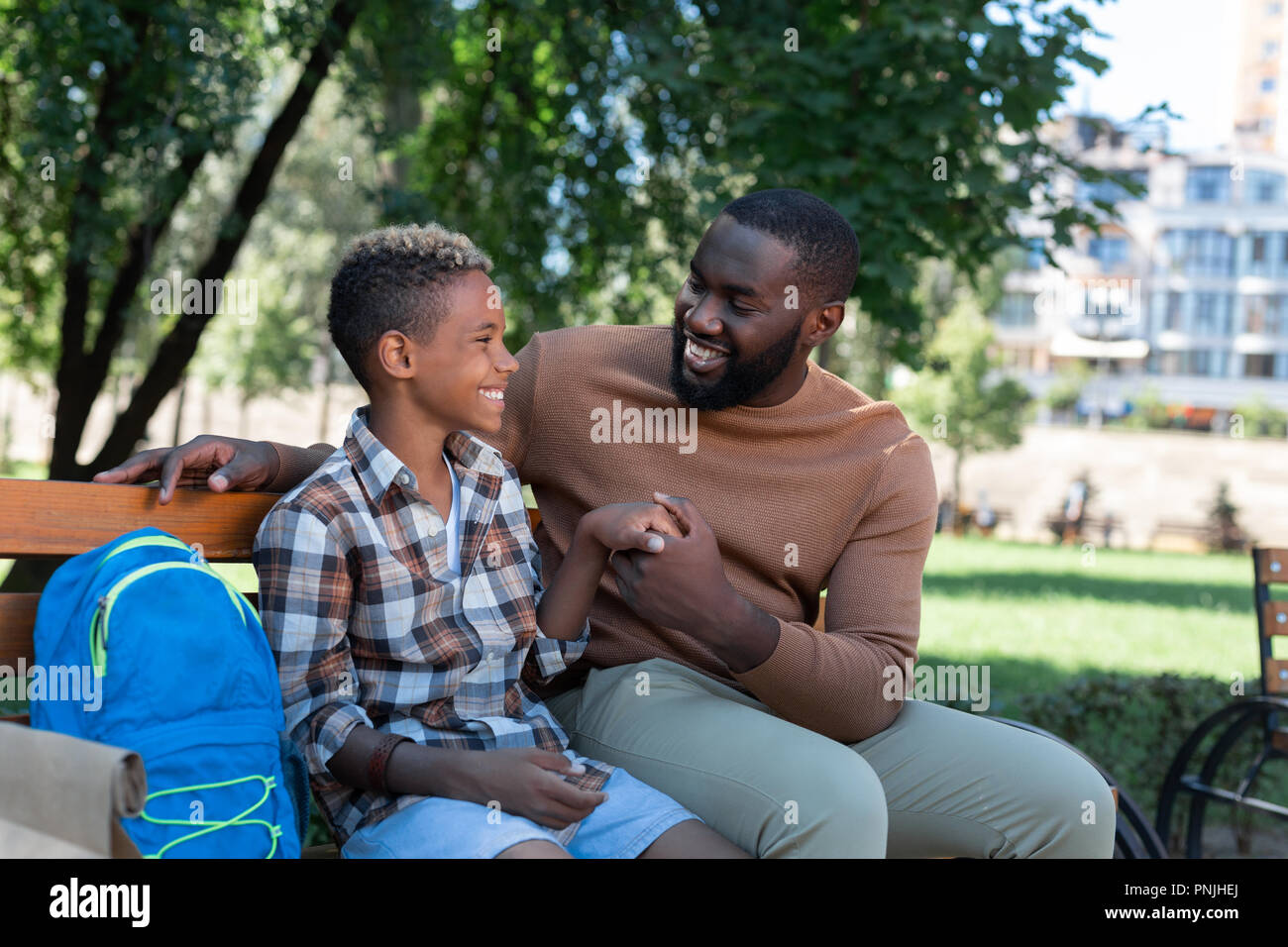 Joyful nice father and son enjoying their time Stock Photo - Alamy