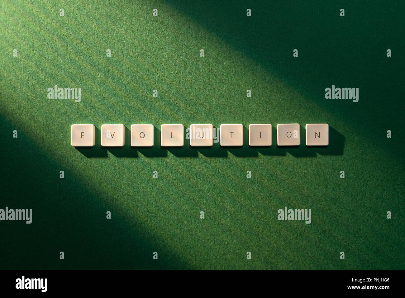 description of the word Evolution with keyboard letters Stock Photo - Alamy