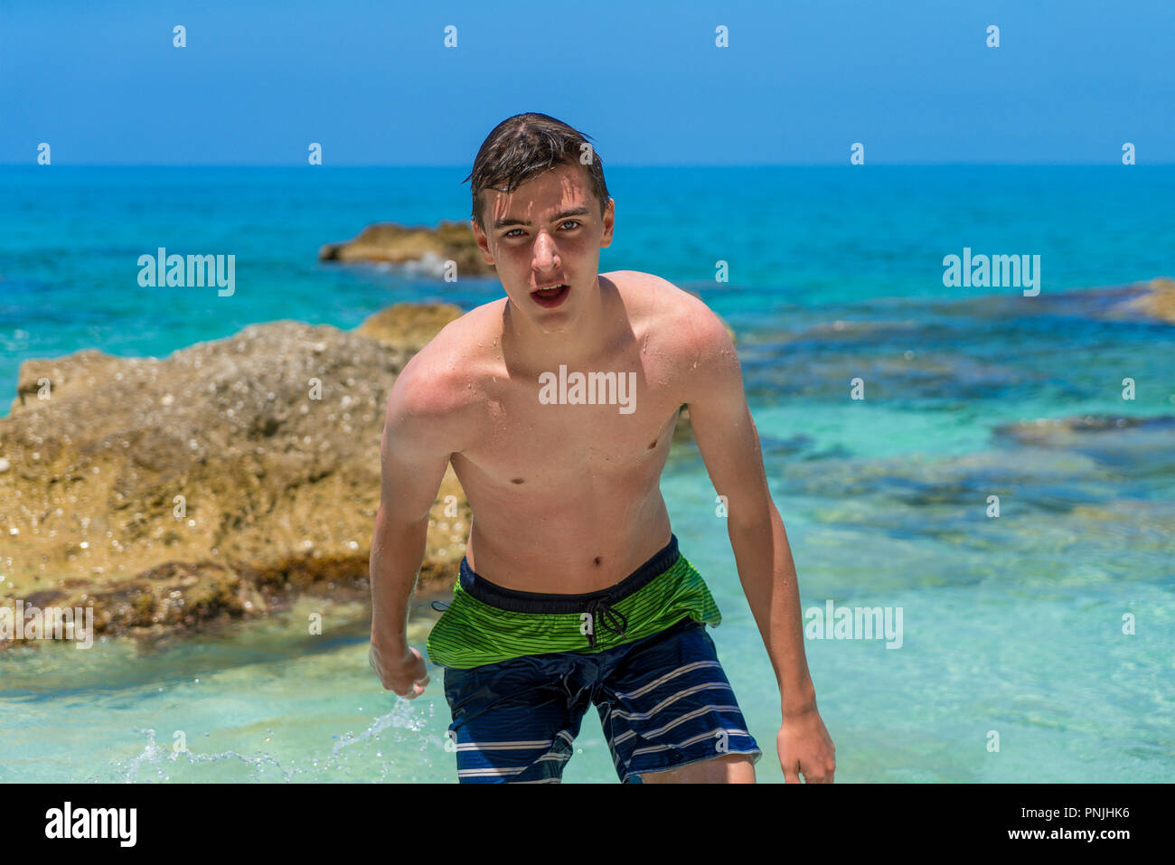 Young man coming out of water hi-res stock photography and images - Alamy
