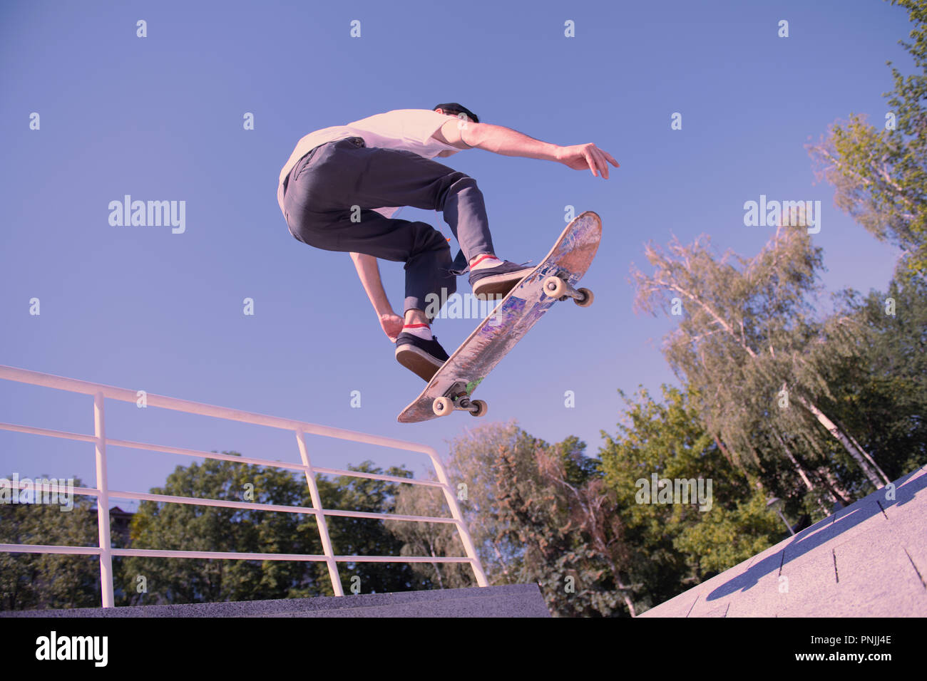 Serious male person keeping balance in air Stock Photo - Alamy