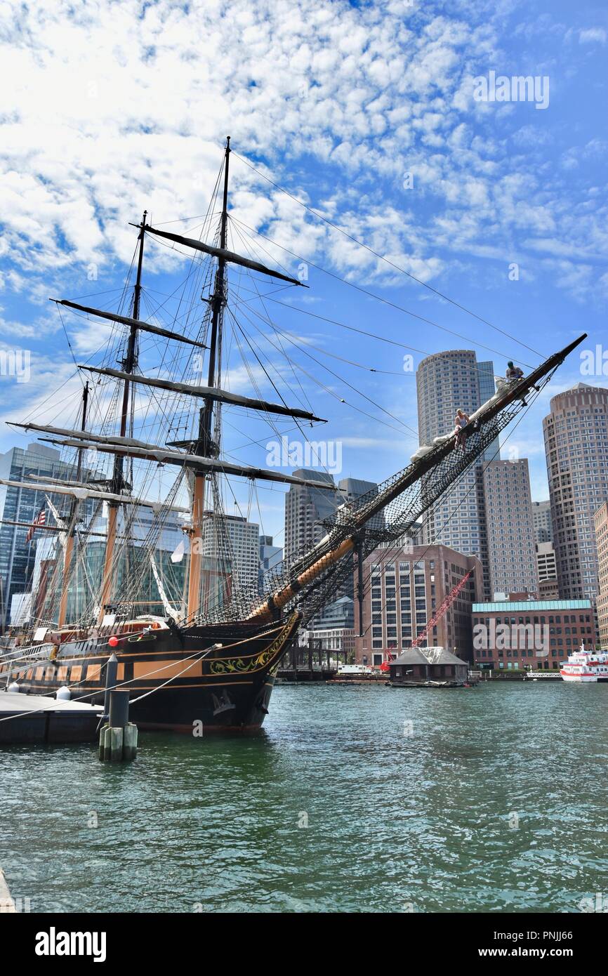 A sailing ship in Boston Harbor against the downtown skyline as seen ...