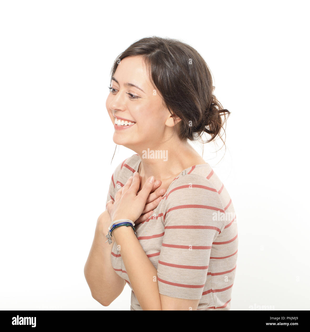 Happy woman with hands to her chest hi-res stock photography and images ...