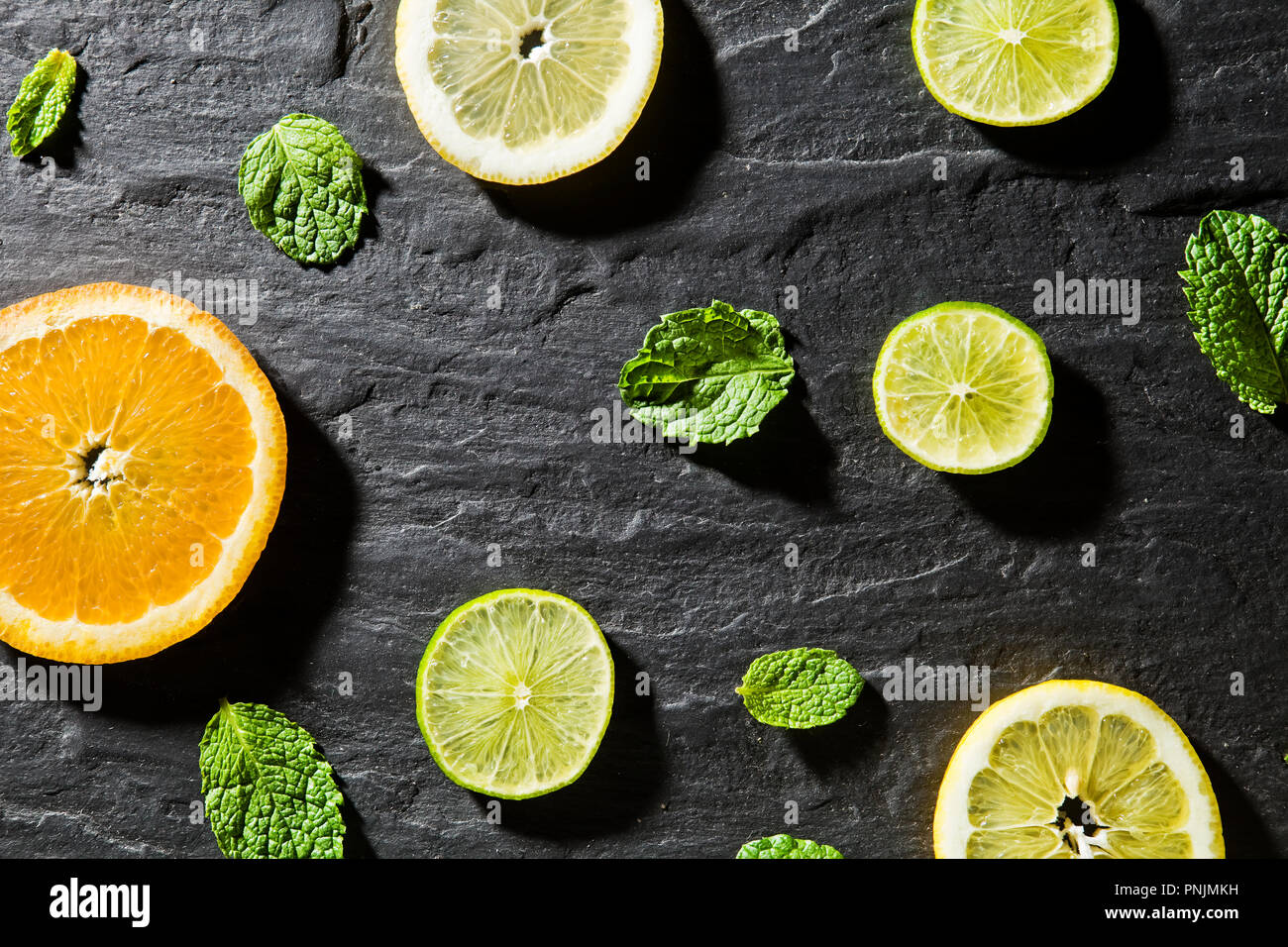 Lime background. Limes with leaves and ice. On the stone table. Free ...