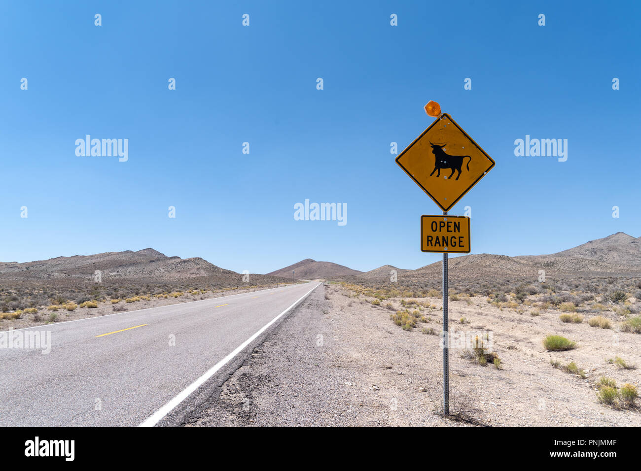 Open Range road sign warning drivers of cattle and cows near the road ...