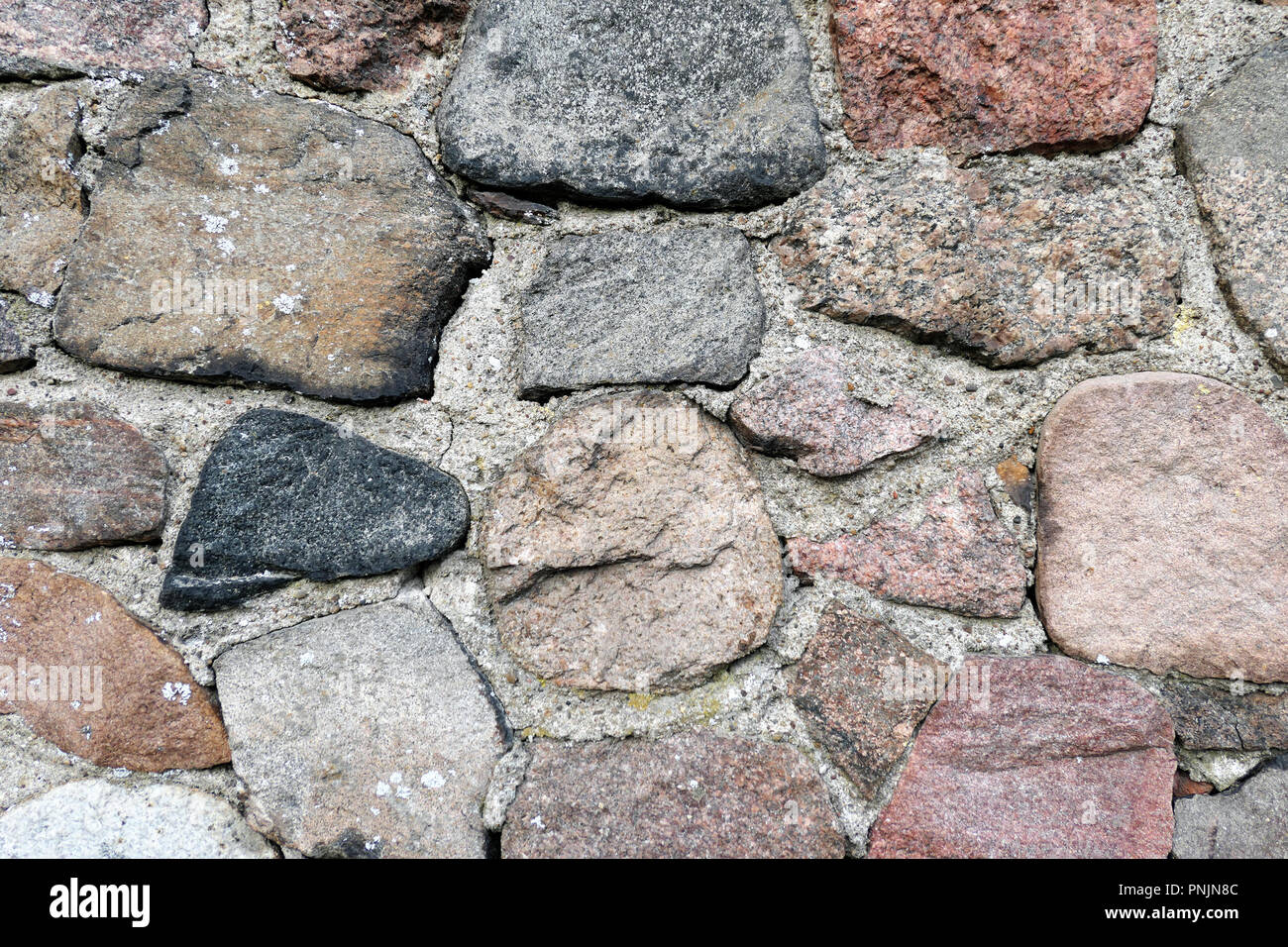 old fieldstone wall of field rocks. full frame background Stock Photo ...