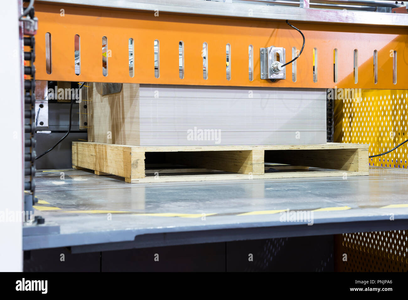 roll of white paper in modern paper cutting machine Stock Photo - Alamy