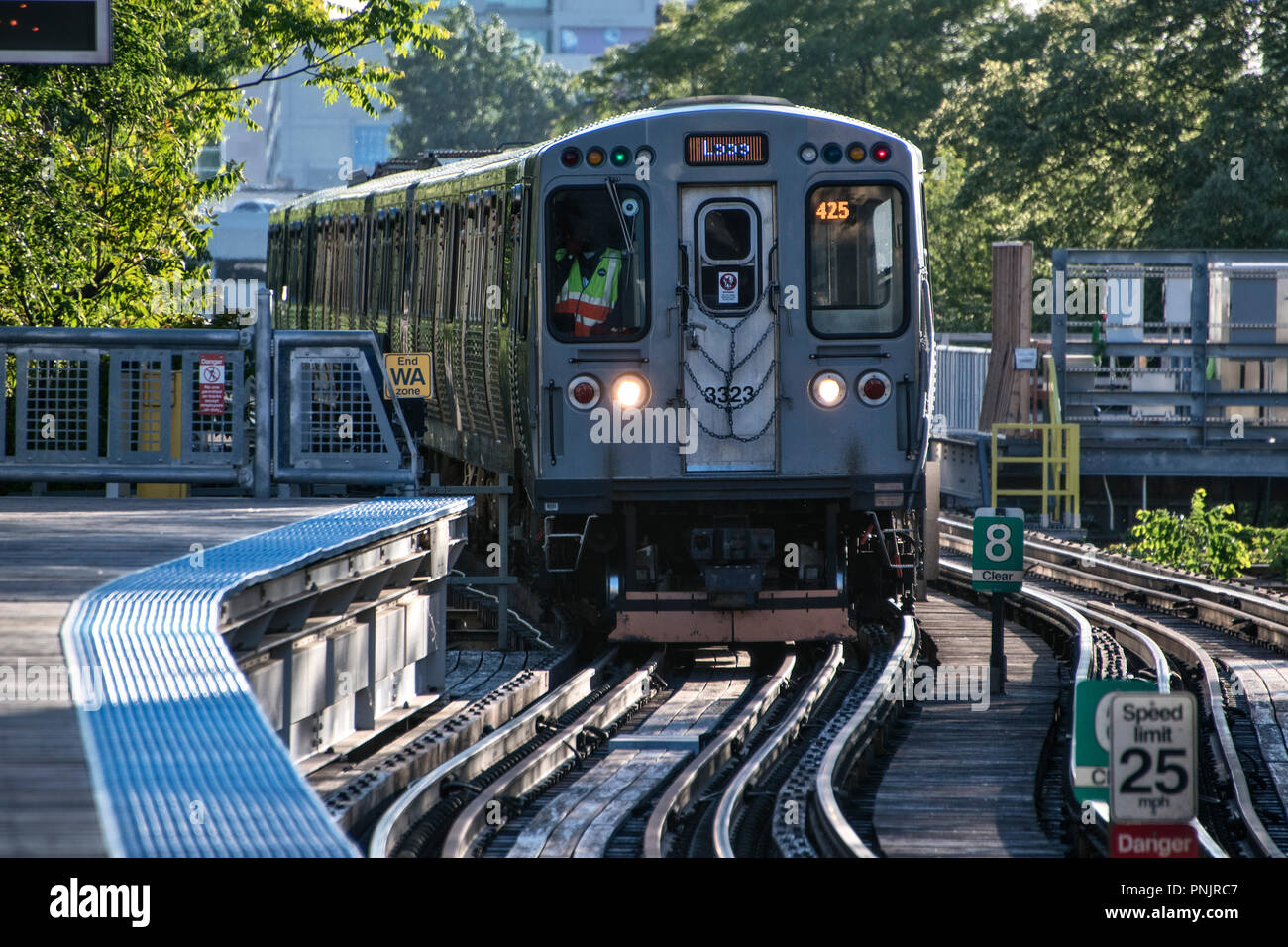 The "L" elevated train approaches the station, Downtown Chicago, IL ...