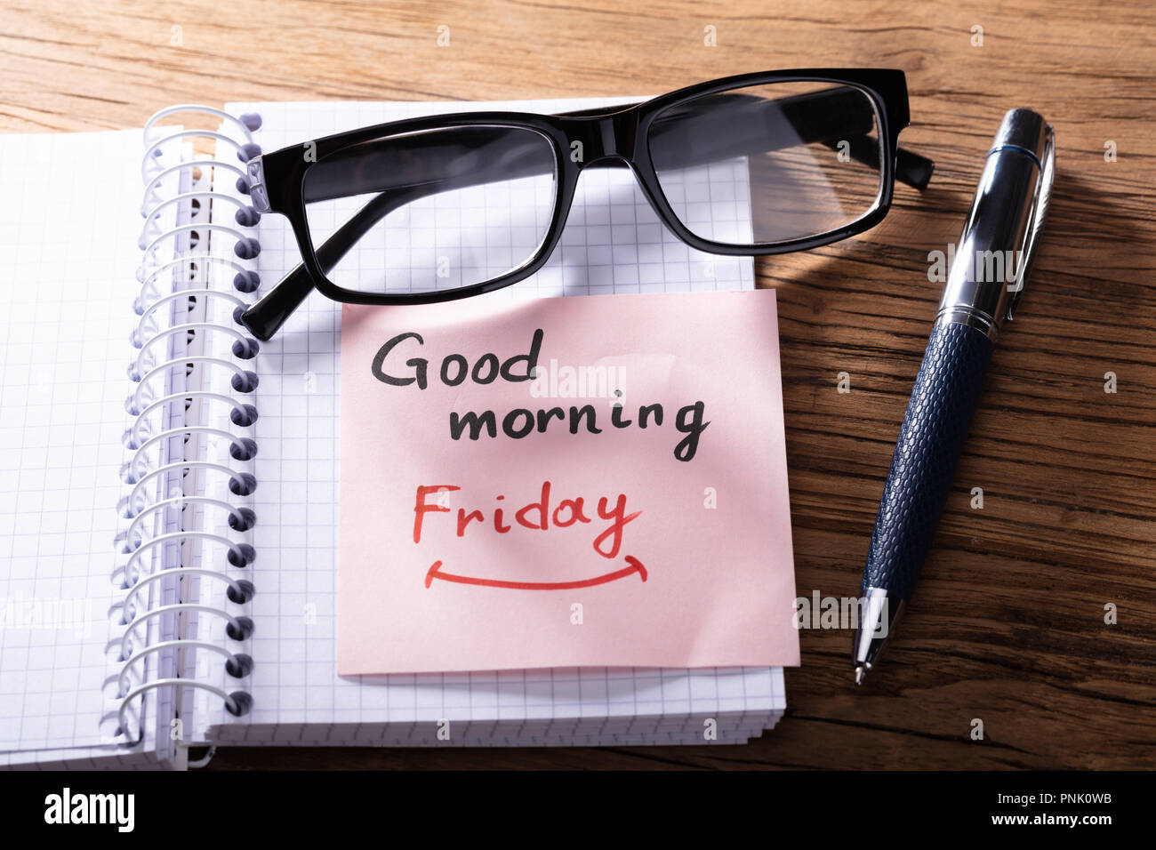Eye Glasses And Adhesive Note With Good Morning Friday Text On Notepad ...