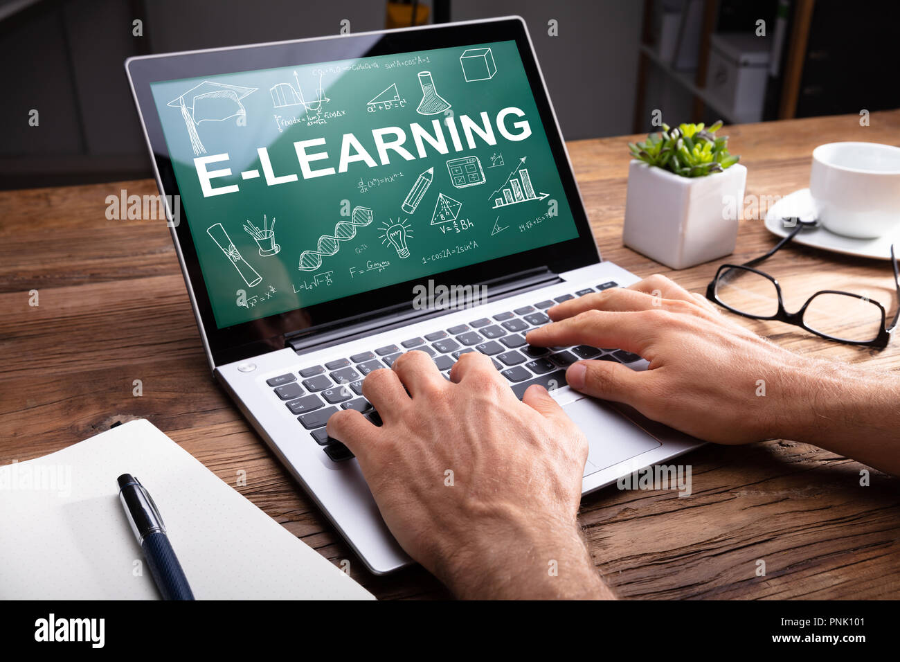 Man's Hand Using Laptop Showing E-learning Concept On Screen Stock ...