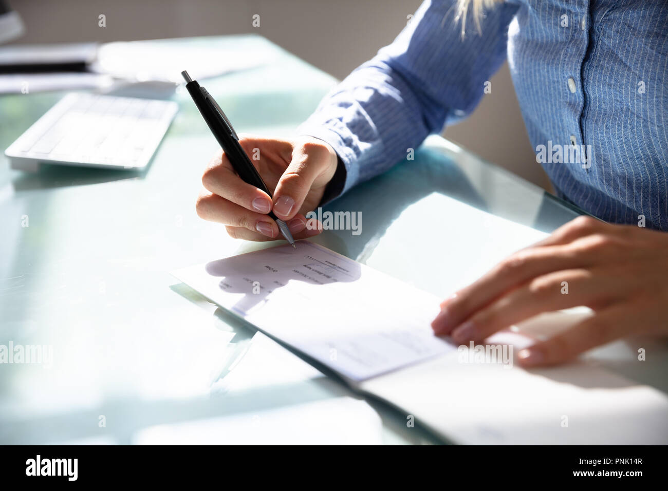 Writing a cheque hi-res stock photography and images - Alamy