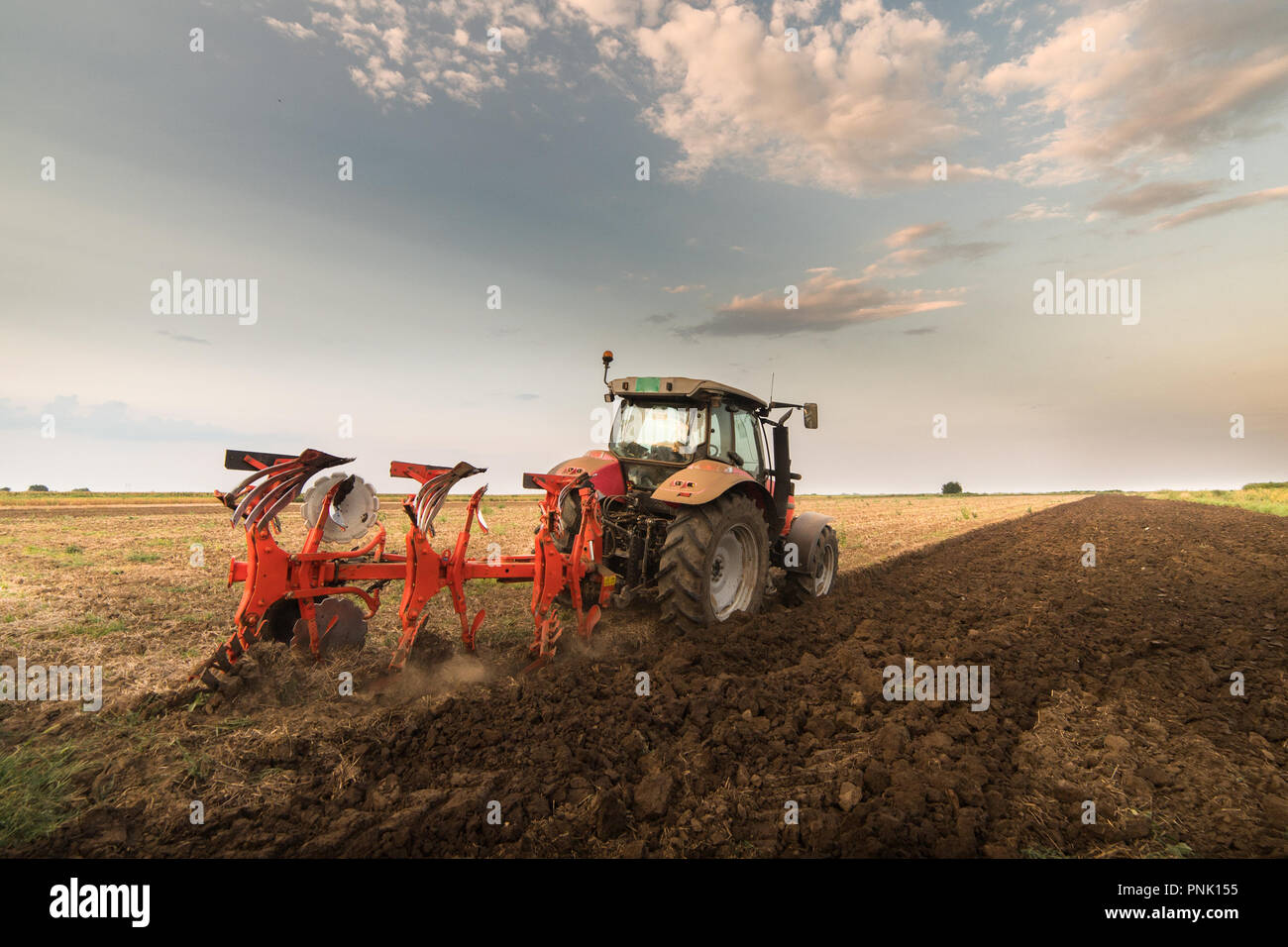 Farmer plowing stubble fields Stock Photo - Alamy