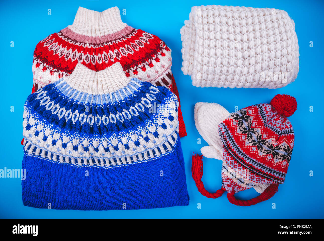 Winter female outfit. Set of clothes and accessories on blue background ...