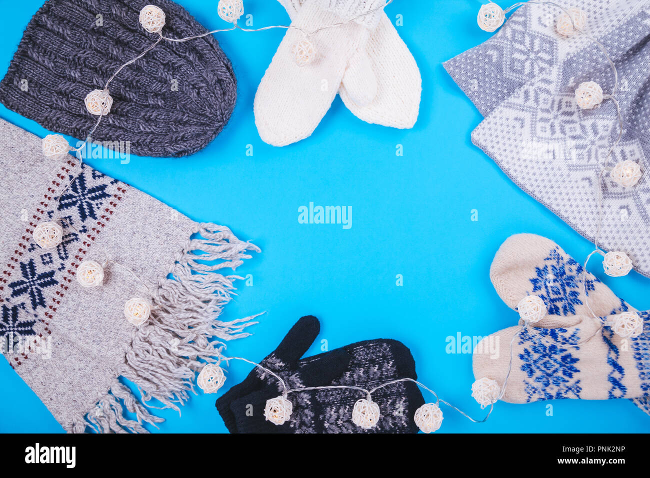 Winter female outfit. Set of clothes on blue background Stock Photo - Alamy