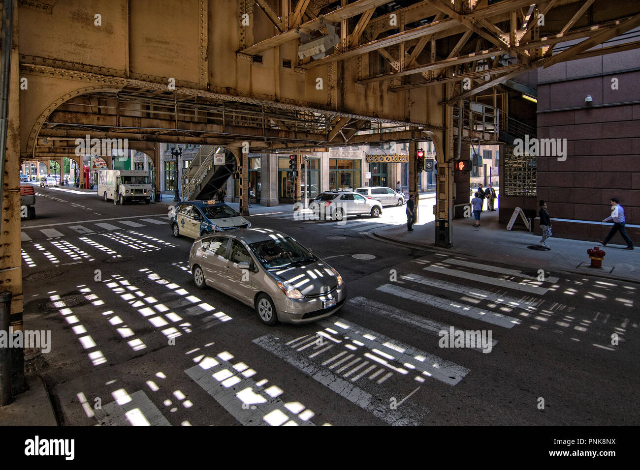 Street under the "L" elevated train, Downtown Chicago, IL Stock Photo ...
