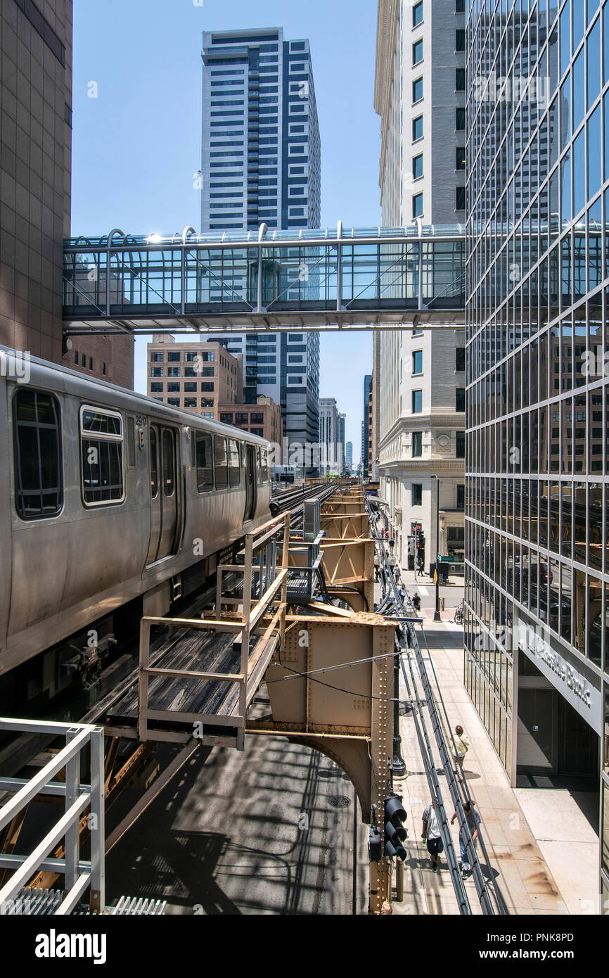 The "L" elevated train arrives at a stop in the Loop, Downtown Chicago ...