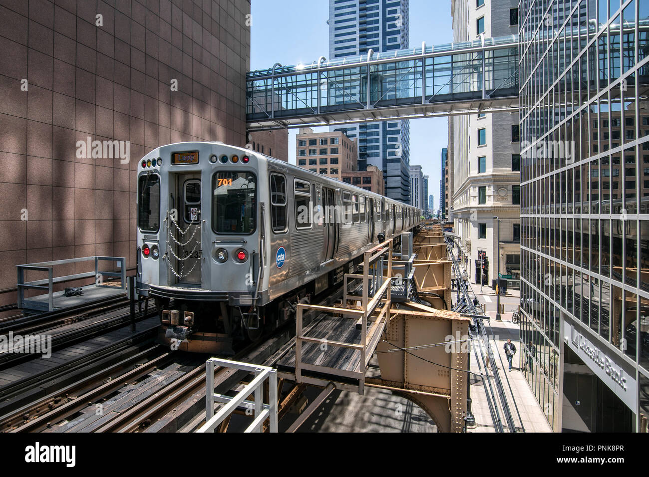 The "L" elevated train arrives at a stop in the Loop, Downtown Chicago ...
