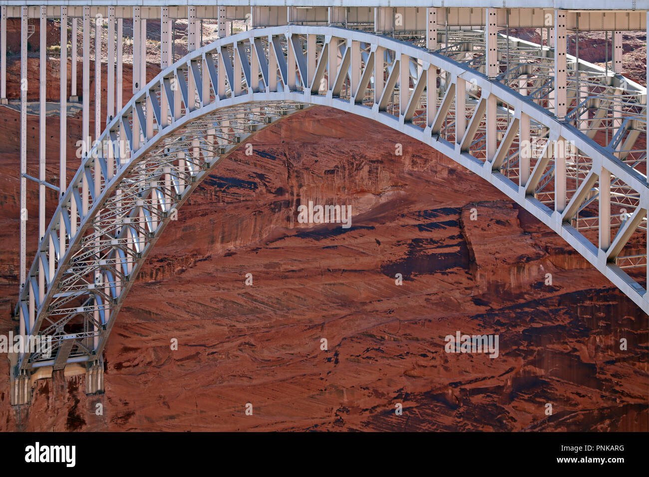 steel bridge over Colorado River with red sandstone background Stock ...