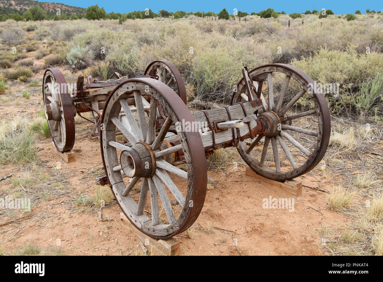 rusty old wagon frame on prairie Stock Photo - Alamy
