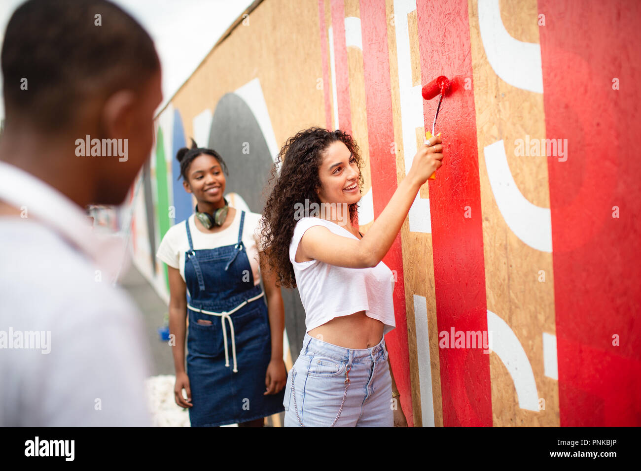 Group of teenagers working together on a community project Stock Photo ...