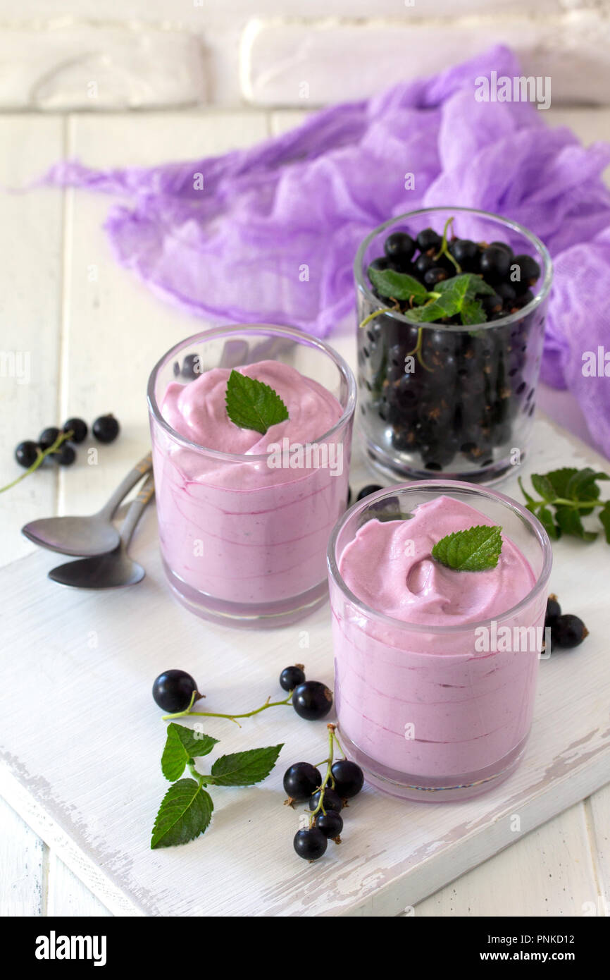 Homemade black currant mousse on wooden table Stock Photo - Alamy